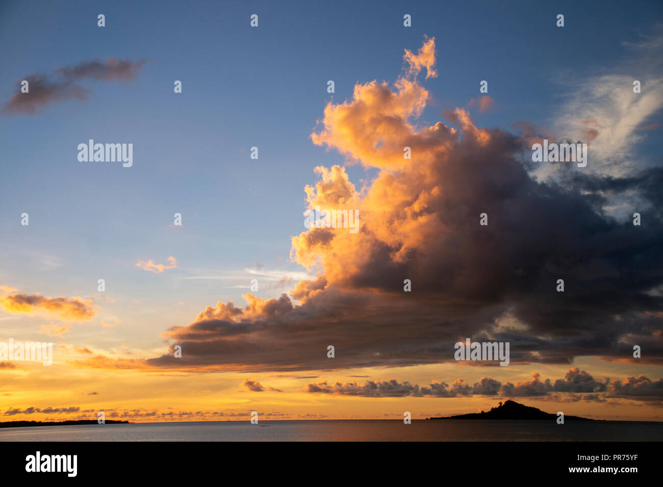 Golden sky with clouds at sunset, U district, Pohnpei, Federated States ...