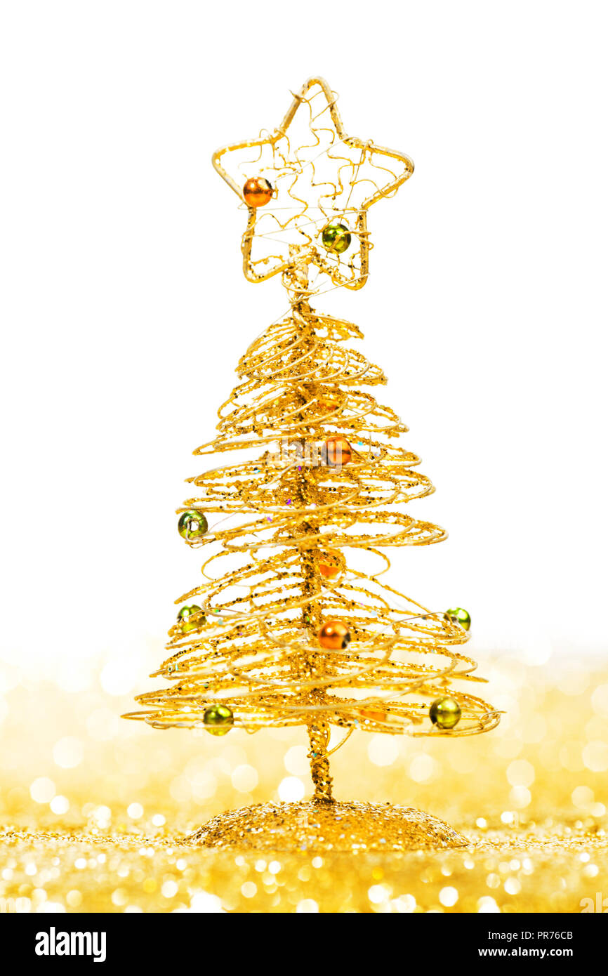 Beautiful golden decorative christmas tree on golden glitter background ...