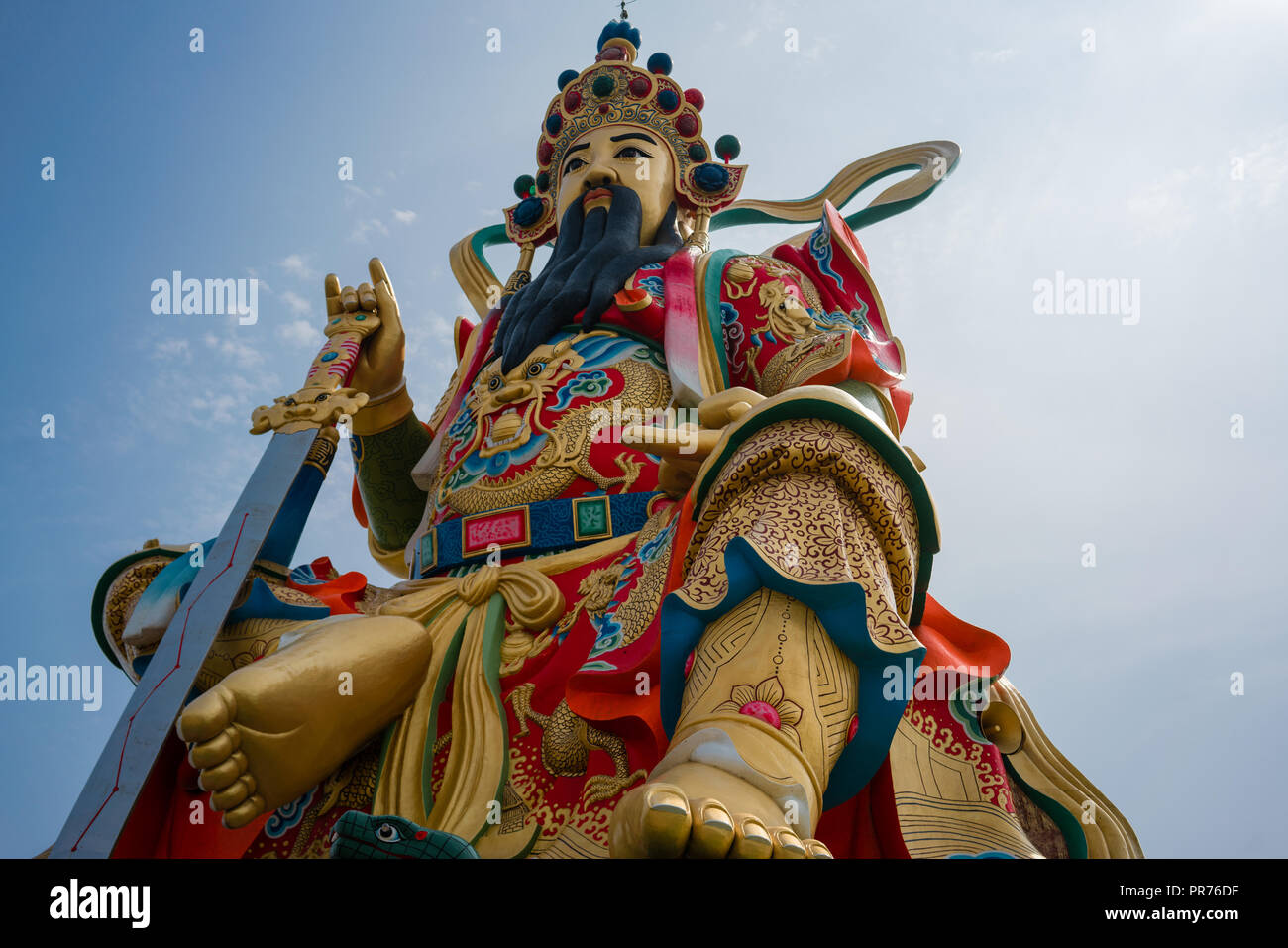 Closeup of statue of taoist god Xuan Tian Shang Di at lotus pond in ...