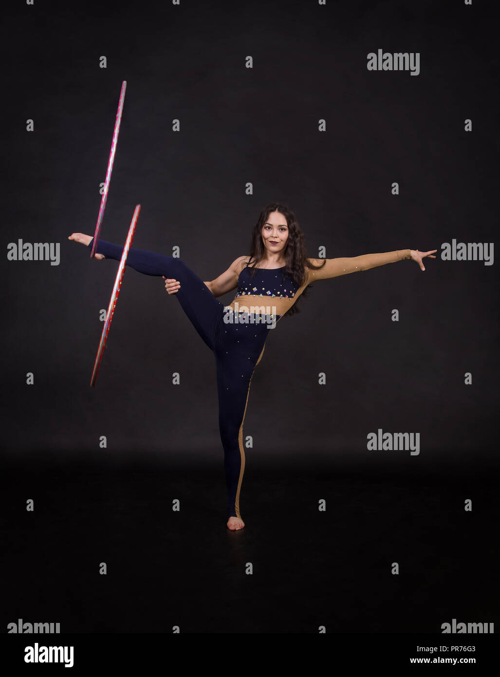 Gymnastic exercises with hula-Hoop woman performs circus performer in ...