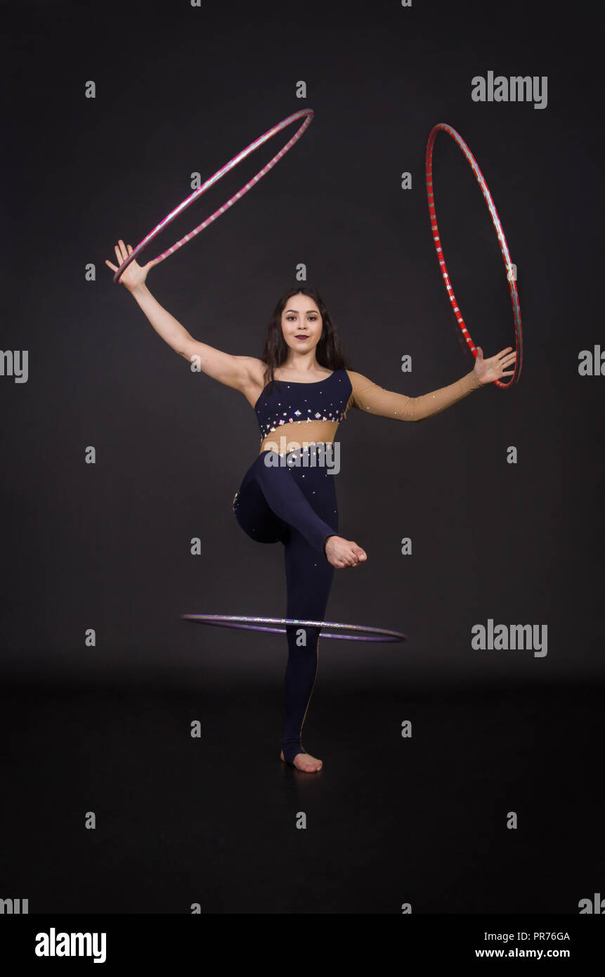 Gymnastic exercises with hula-Hoop woman performs circus performer in ...