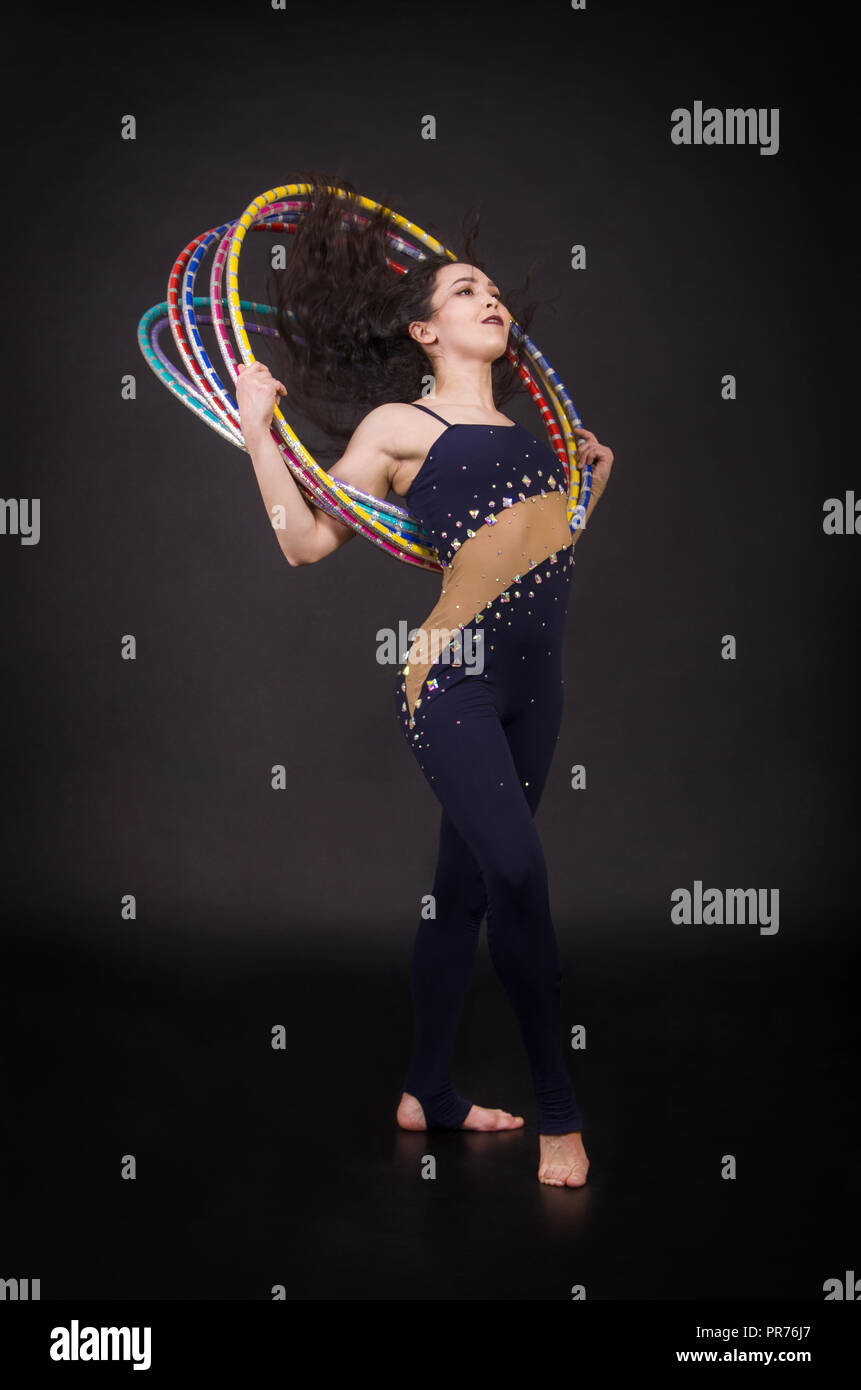 Gymnastic exercises with hula-Hoop woman performs circus performer in ...
