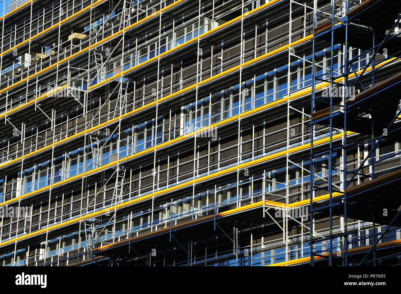 metal scaffold at facade of an office building in business district ...