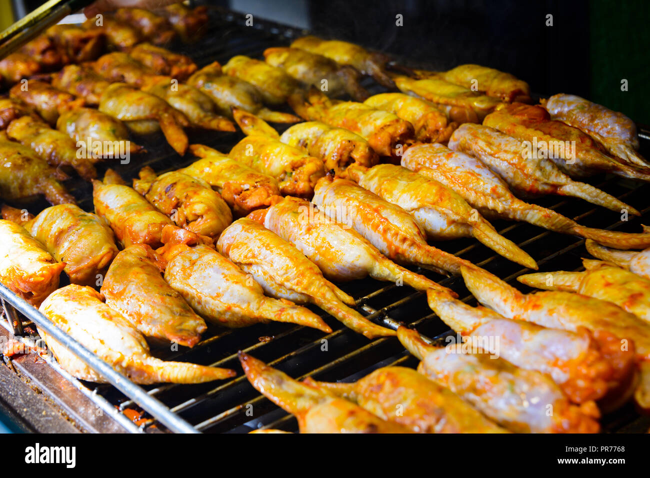 Chinese stuffed chicken wings on barbeque Stock Photo - Alamy