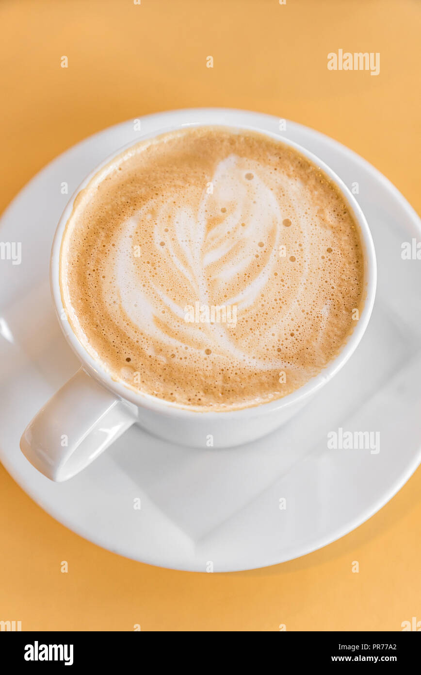 Cafe Late with lette art on coffee Stock Photo - Alamy