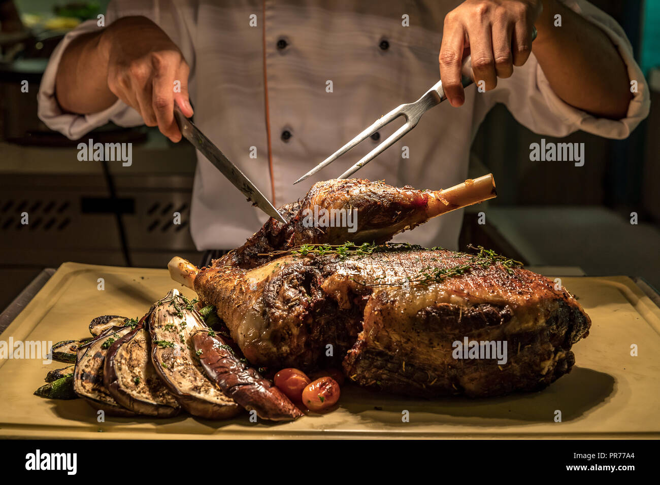 Carving of Roasted lamb meat Stock Photo - Alamy