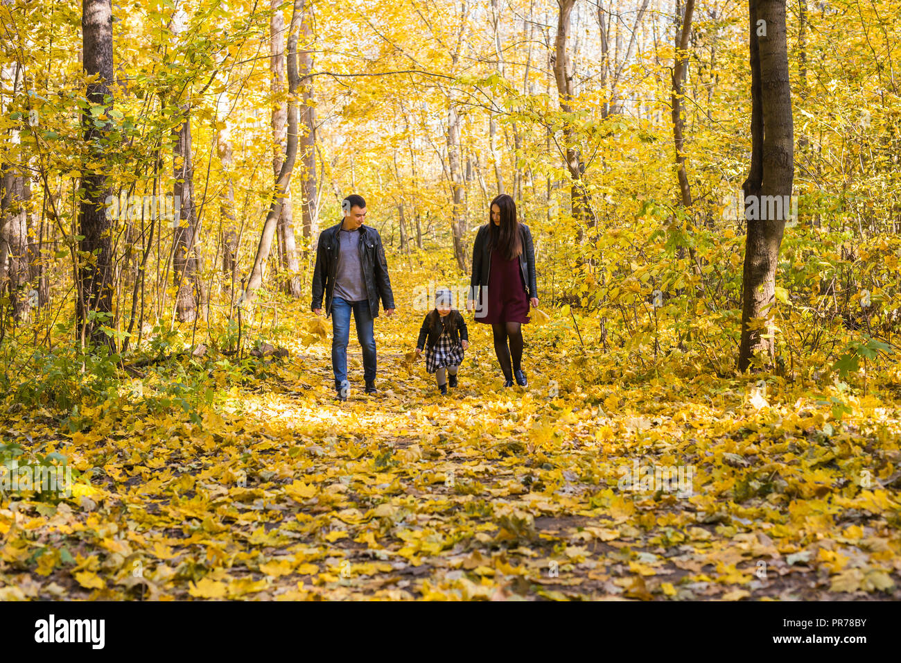 Children, nature and family concept - Portrait of happy family over ...