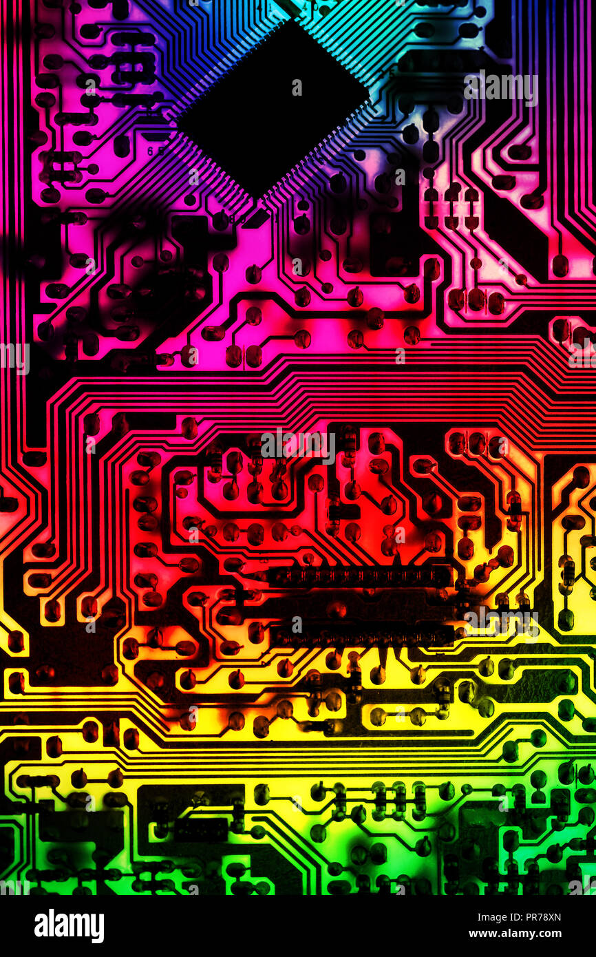 Abstract image of a circuit board with multi-coloured spectrum design ...