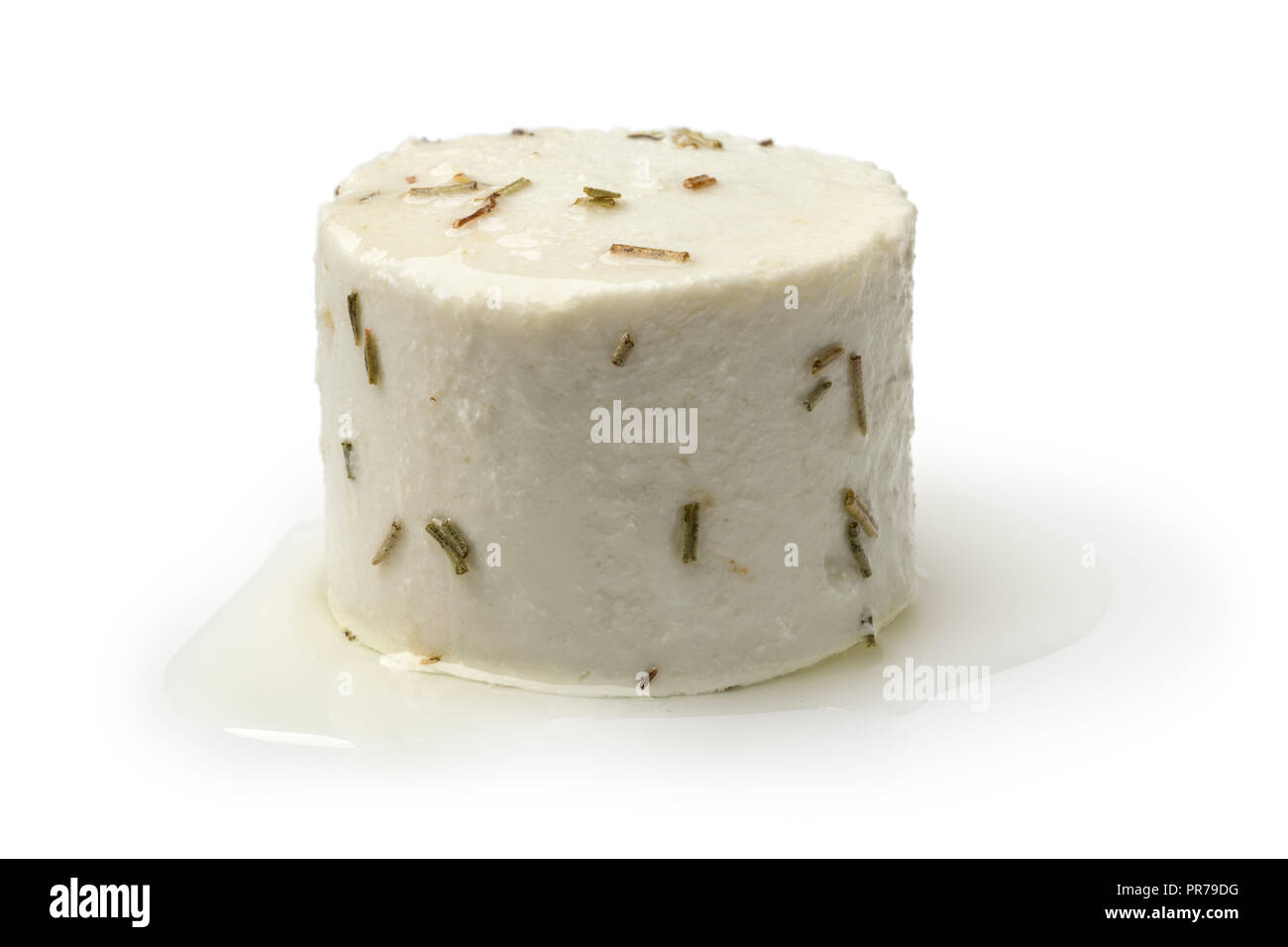 Single preserved white organic Dutch goat cheese and herbs isolated on ...