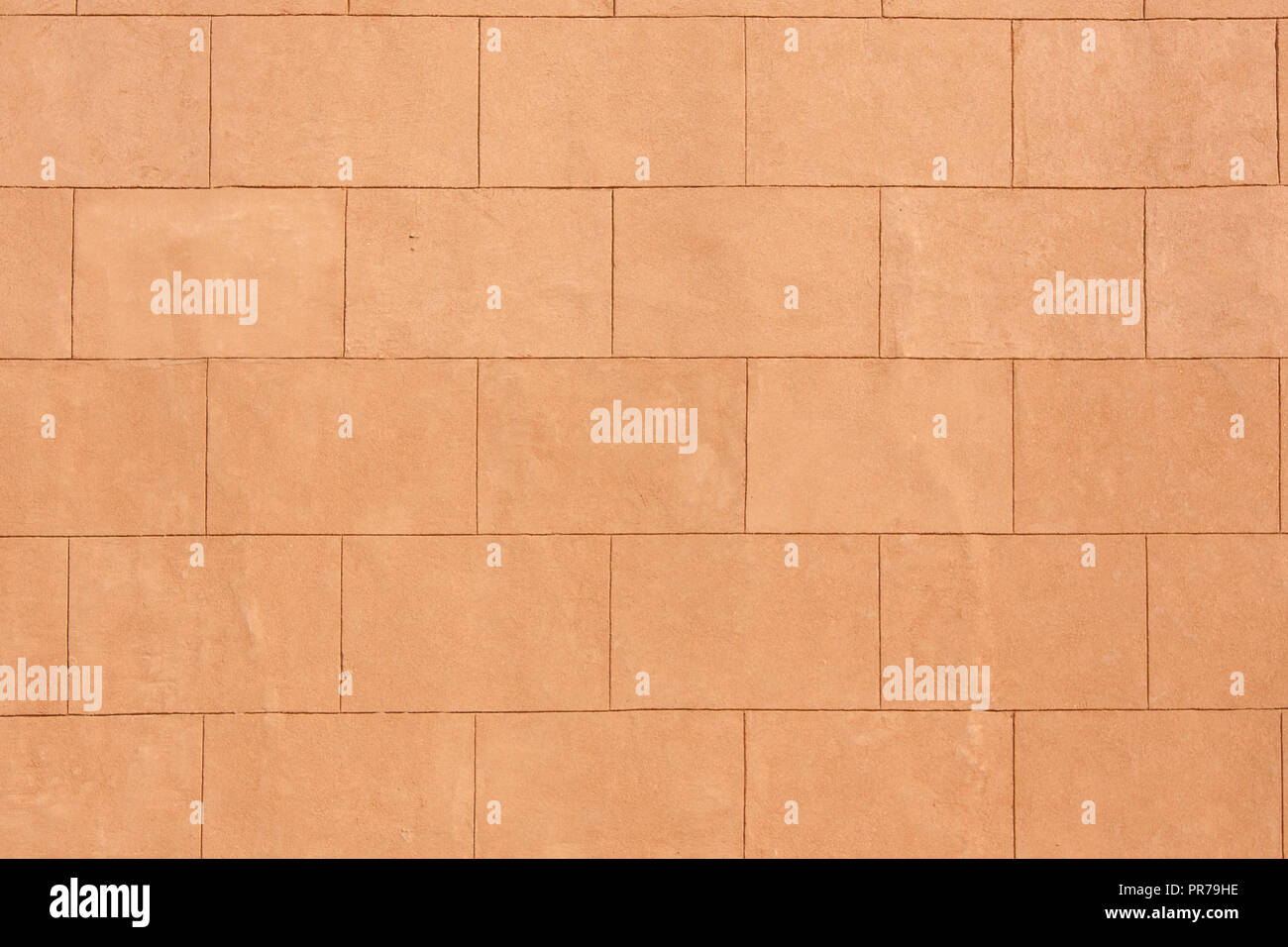 Orange wall of large bricks. Texture Stock Photo - Alamy