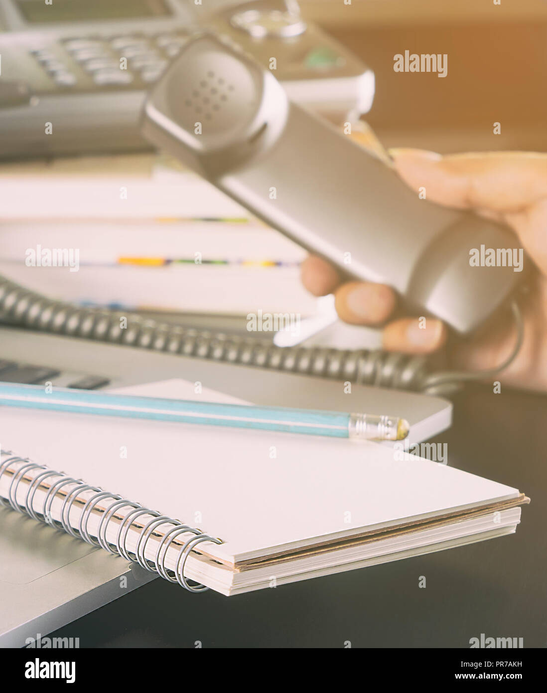 travel agency staff is taking call for flight booking Stock Photo - Alamy