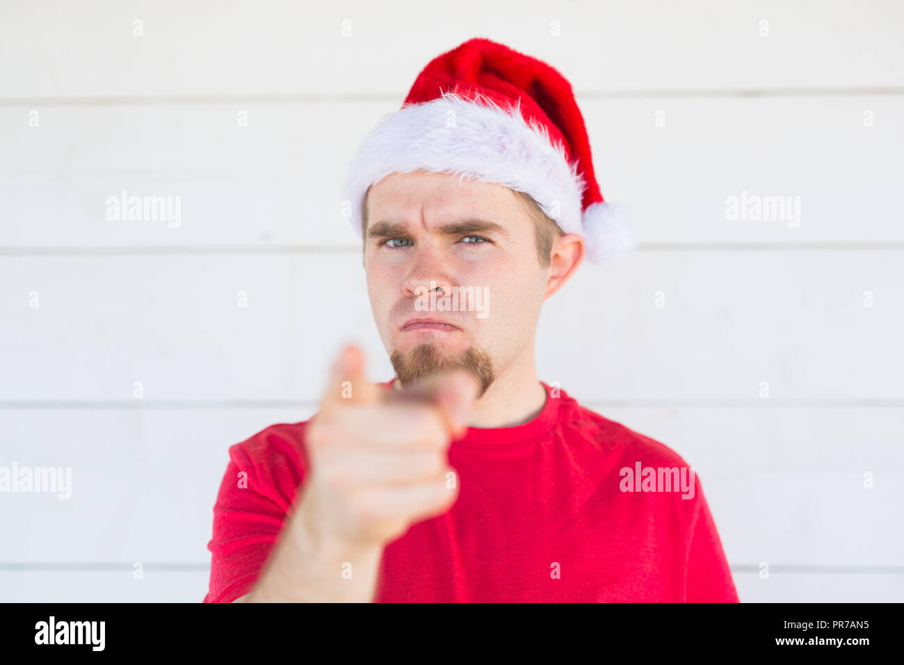 Christmas, people, emotions concept - dissatisfied angry santa in ...