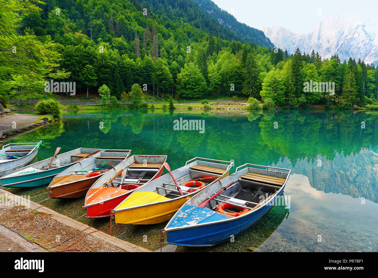 Colored Boats at lake of mountain Stock Photo - Alamy