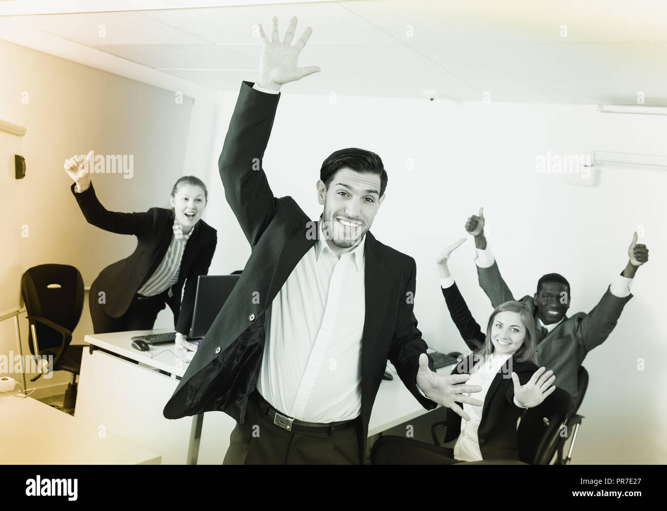 Successful multinational business team expressing satisfaction with ...