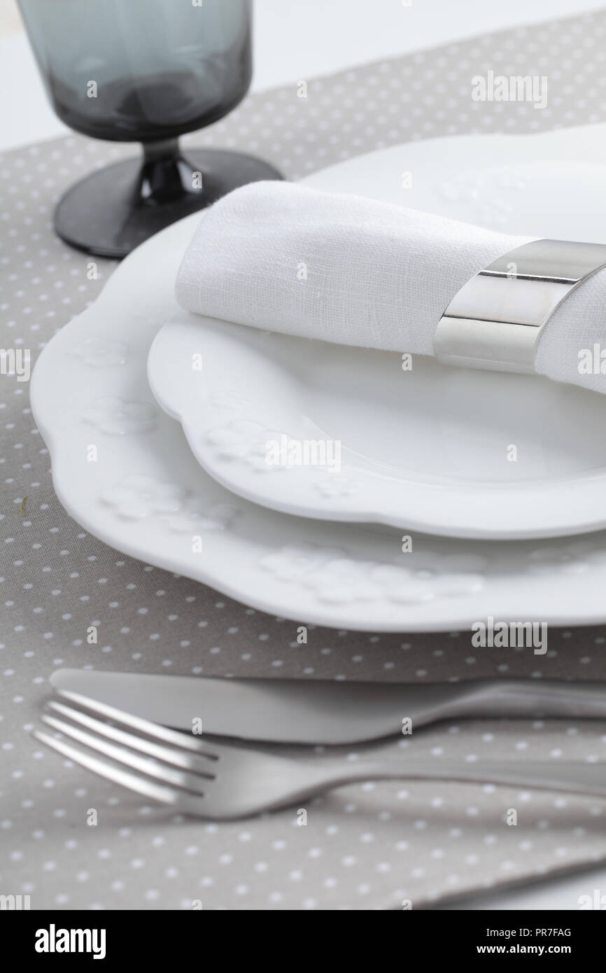 Elegant table setting with white napkin Stock Photo - Alamy