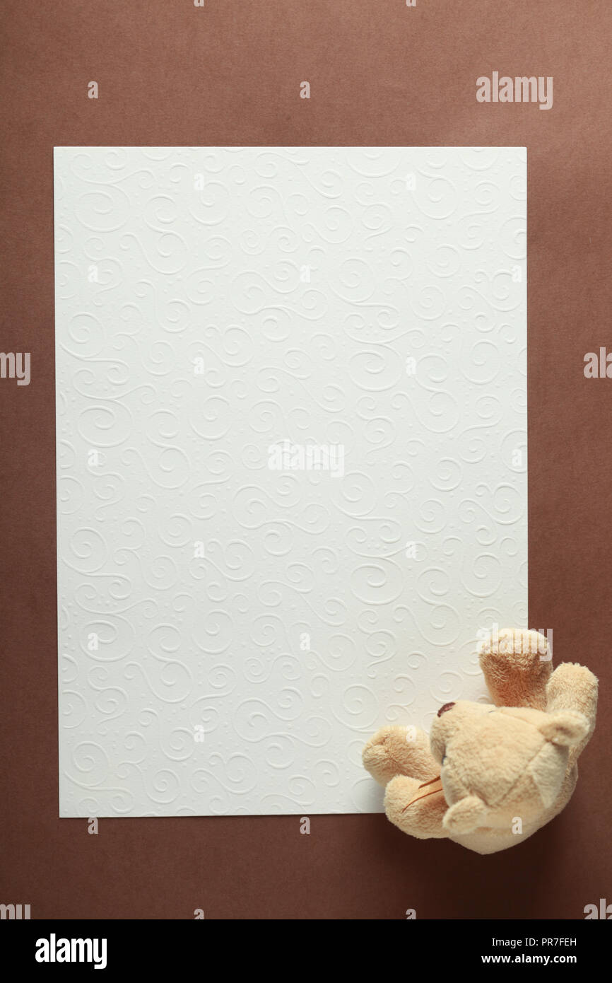 Frame with imprinted paper and Teddy Bear Stock Photo - Alamy