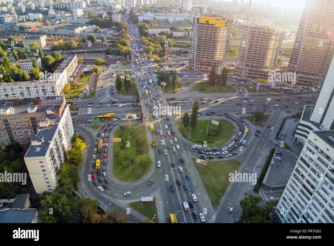 Aerial drone view of two level road junction during rush hour. Traffic ...
