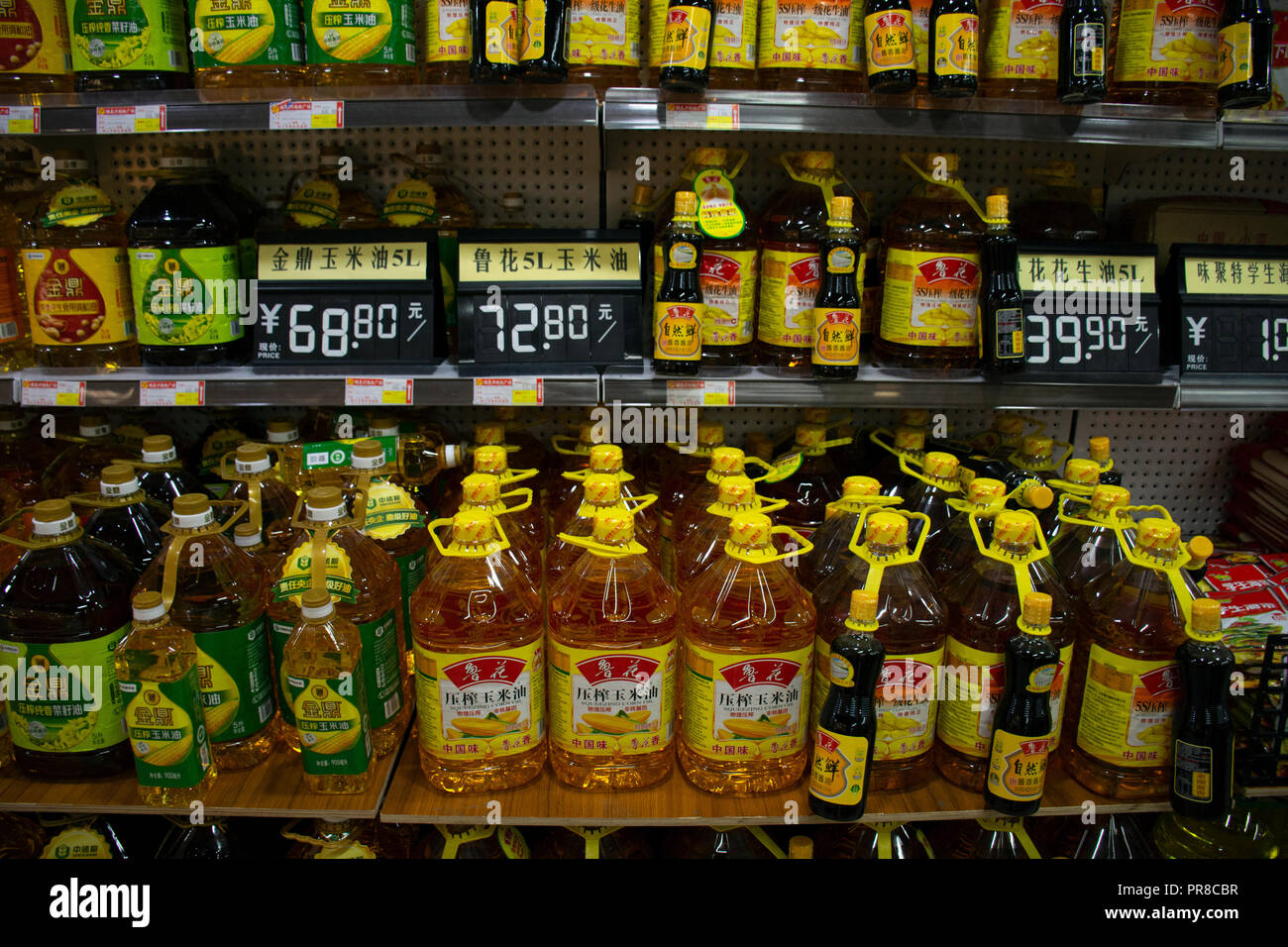 Cooking oils for sale in a grocery shop, Haikou, Hainan Island, China ...