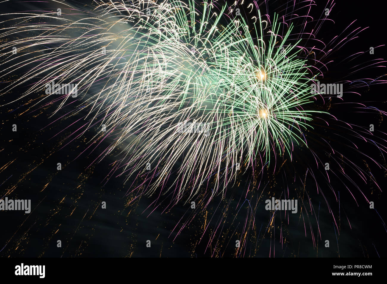bizarre fireworks background, multicolour festive fireworks in night ...