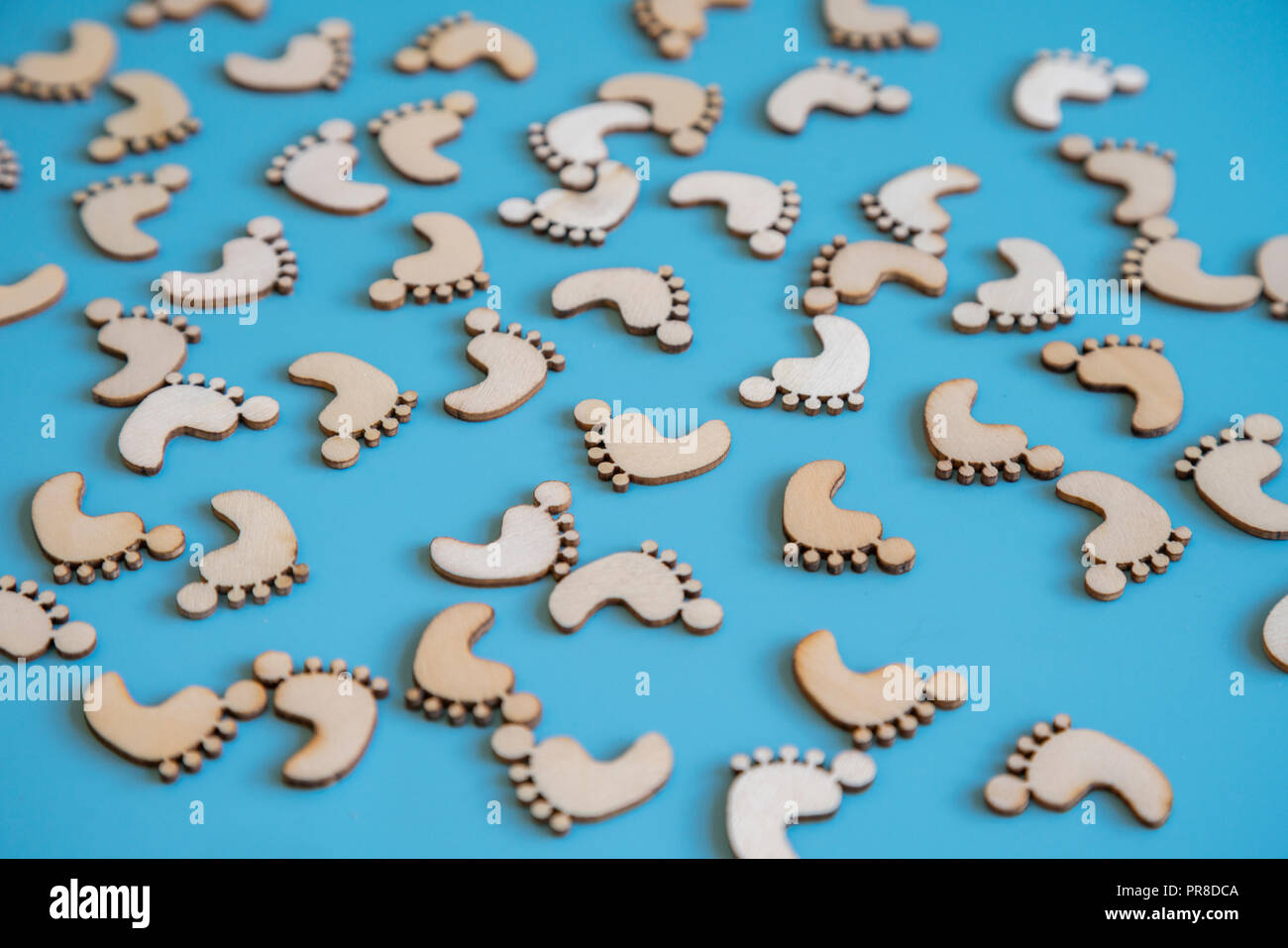 Footprints on a blue background. Wooden traces are scattered on a blue ...