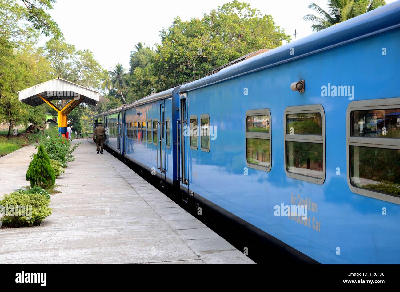 Blue Sri Lanka Colombo to Jaffna railway train parked at platform Stock ...