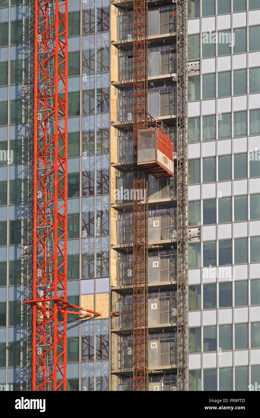Service elevator at building exterior during construction Stock Photo ...