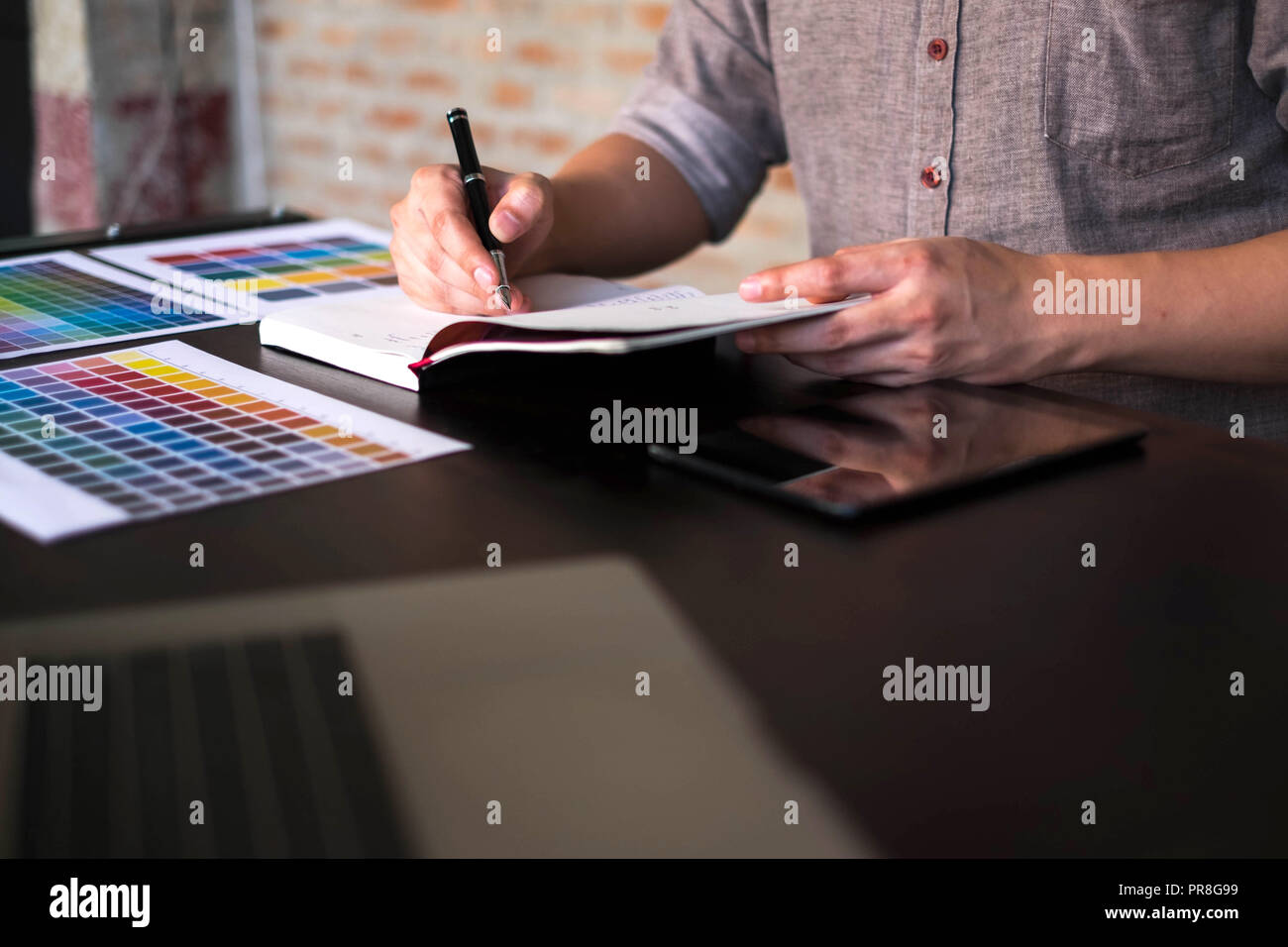 Graphic designers choose colors from the color bands samples for design ...