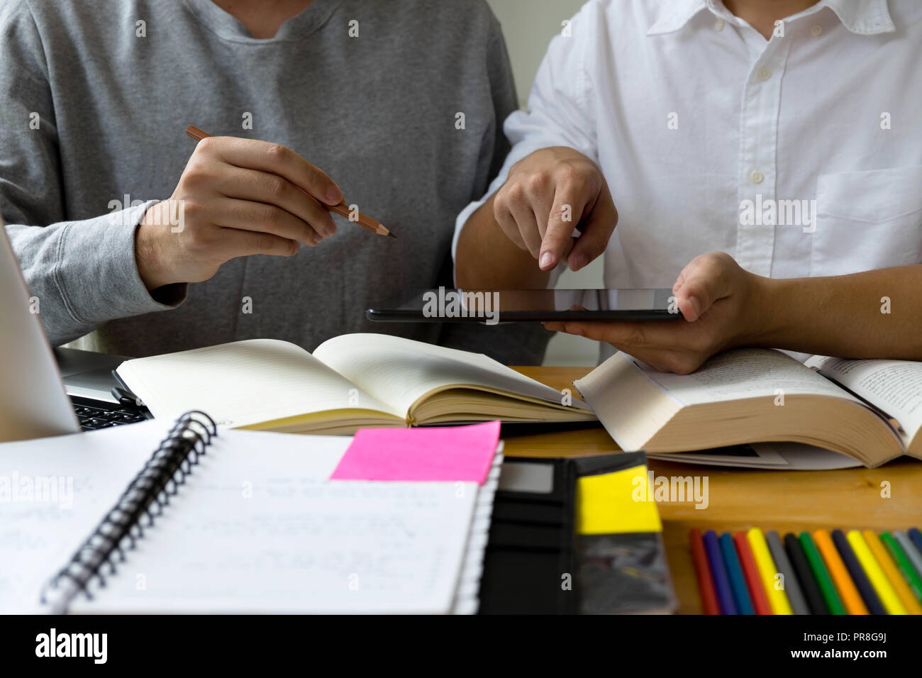 Students helps friend teaching and learning subject additional in ...
