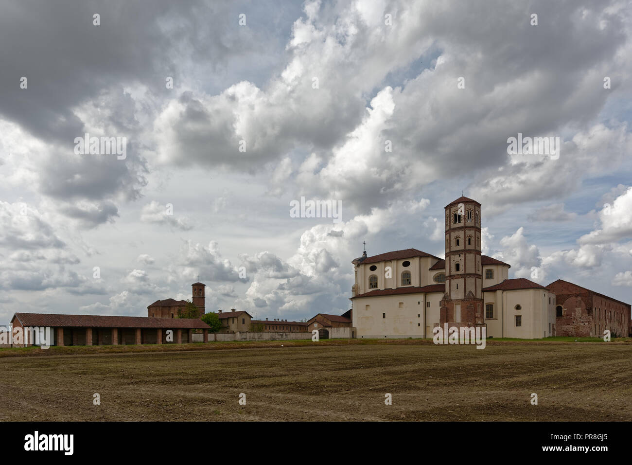 Santa Maria di Lucedio abbey surrounded by plowed fields Stock Photo ...