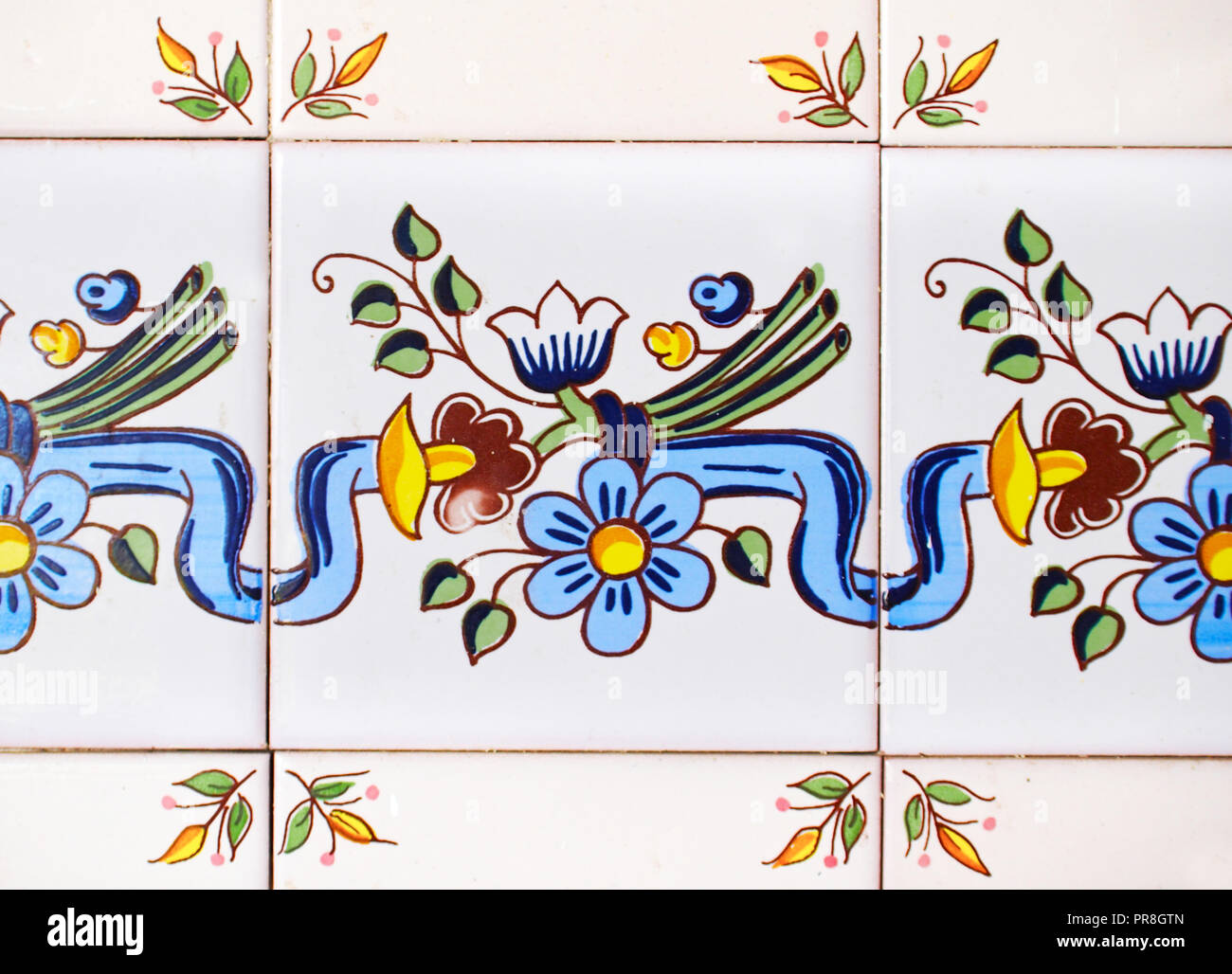 Detail of the traditional tiles from facade of old house. Decorative ...