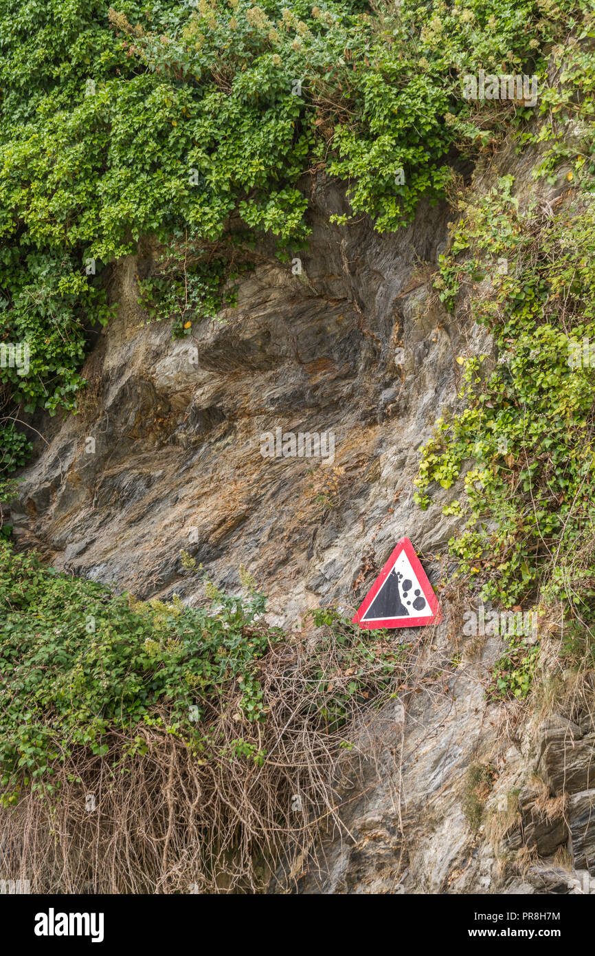 Coastal scene around Newquay, Cornwall. Beware of falling rocks warning ...
