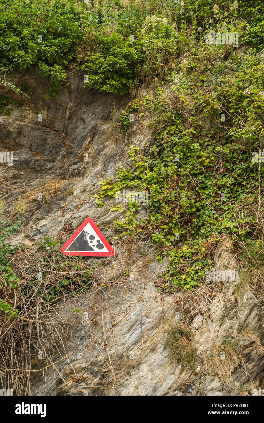 Coastal scene around Newquay, Cornwall. Beware of falling rocks warning ...