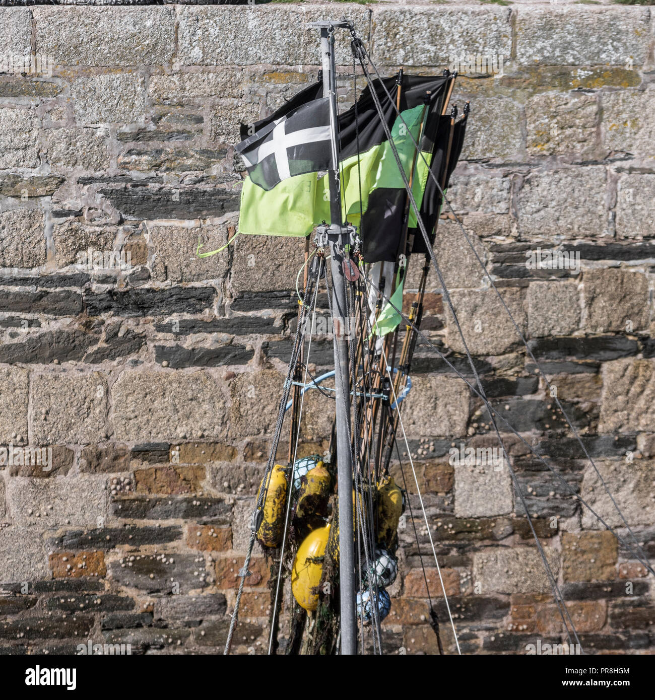 Harbour scenes around Newquay, Cornwall. St. Pirrin's Cornish pennant ...