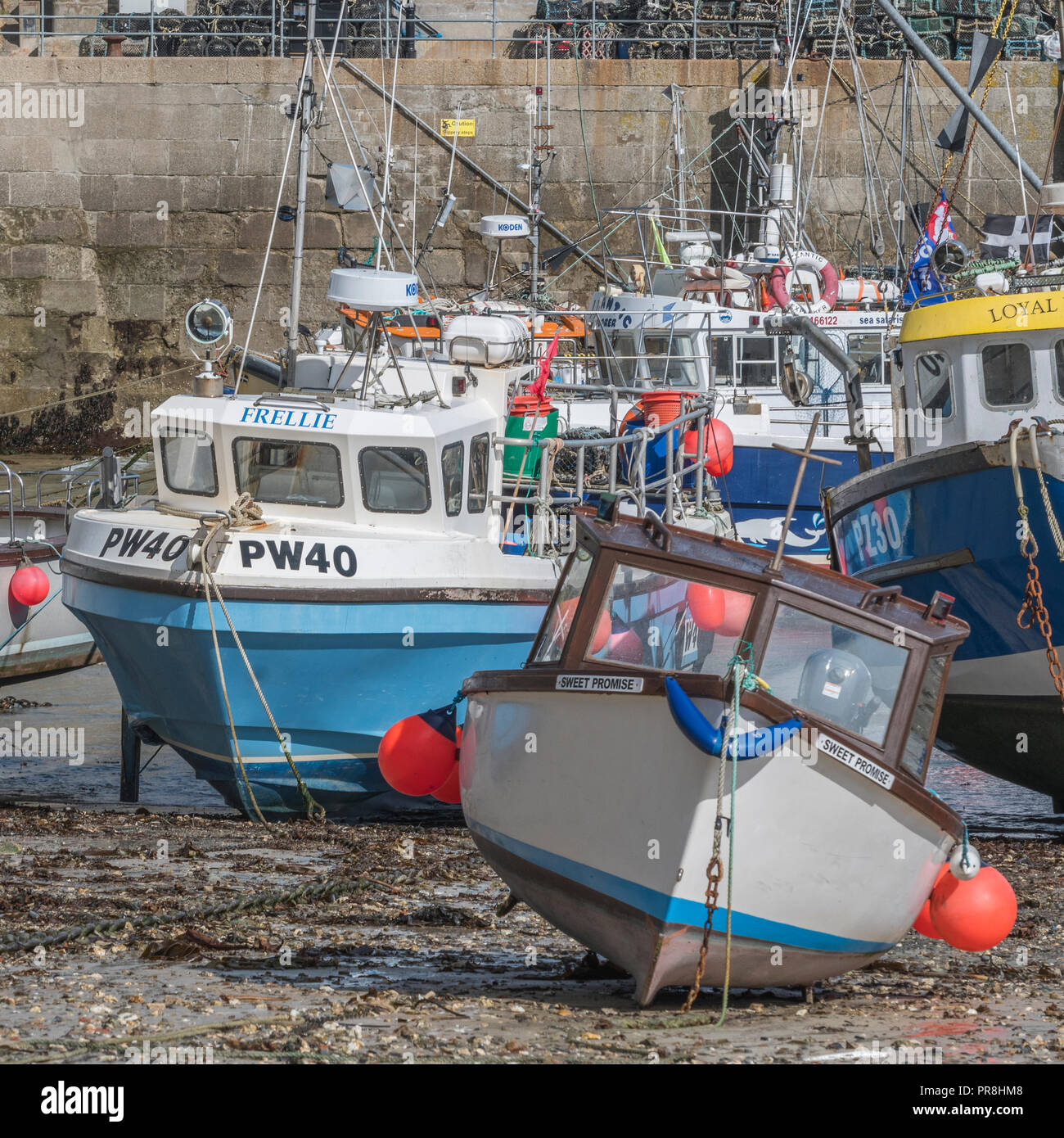 Harbour scenes around Newquay, Cornwall. Boat mooring chained visible ...