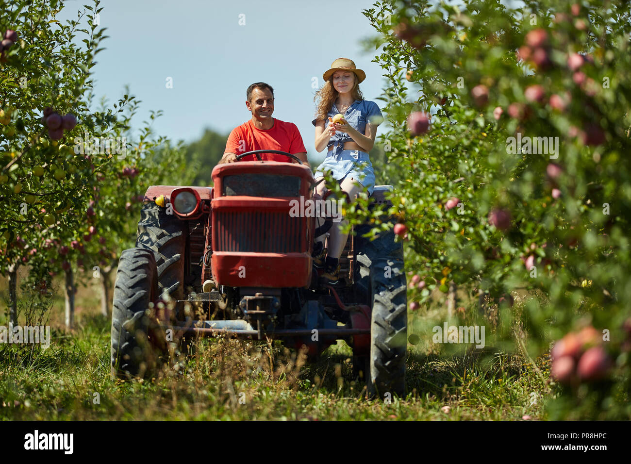 Woman farmer driving old tractor hi-res stock photography and images - Alamy