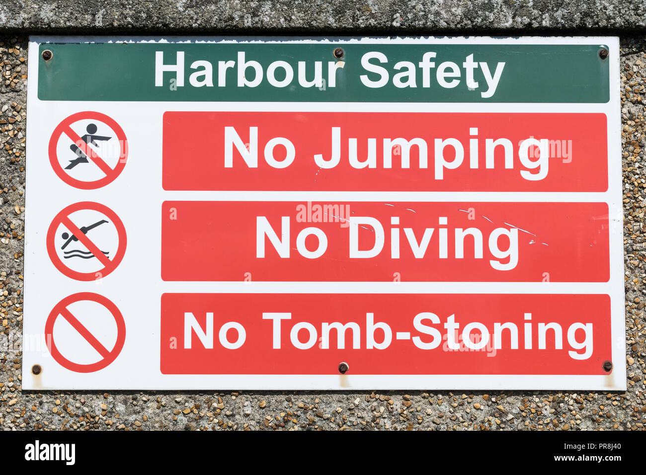 Harbour scenes around Newquay, Cornwall. Harbour safety warning sign ...