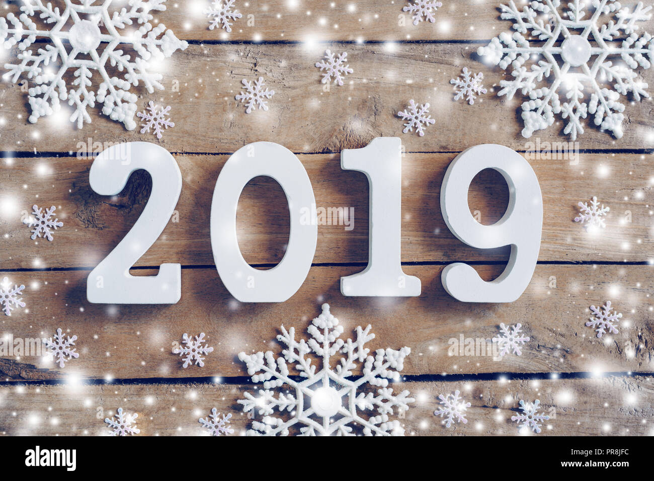 Wooden numbers forming the number 2019, For the new year and white snow ...