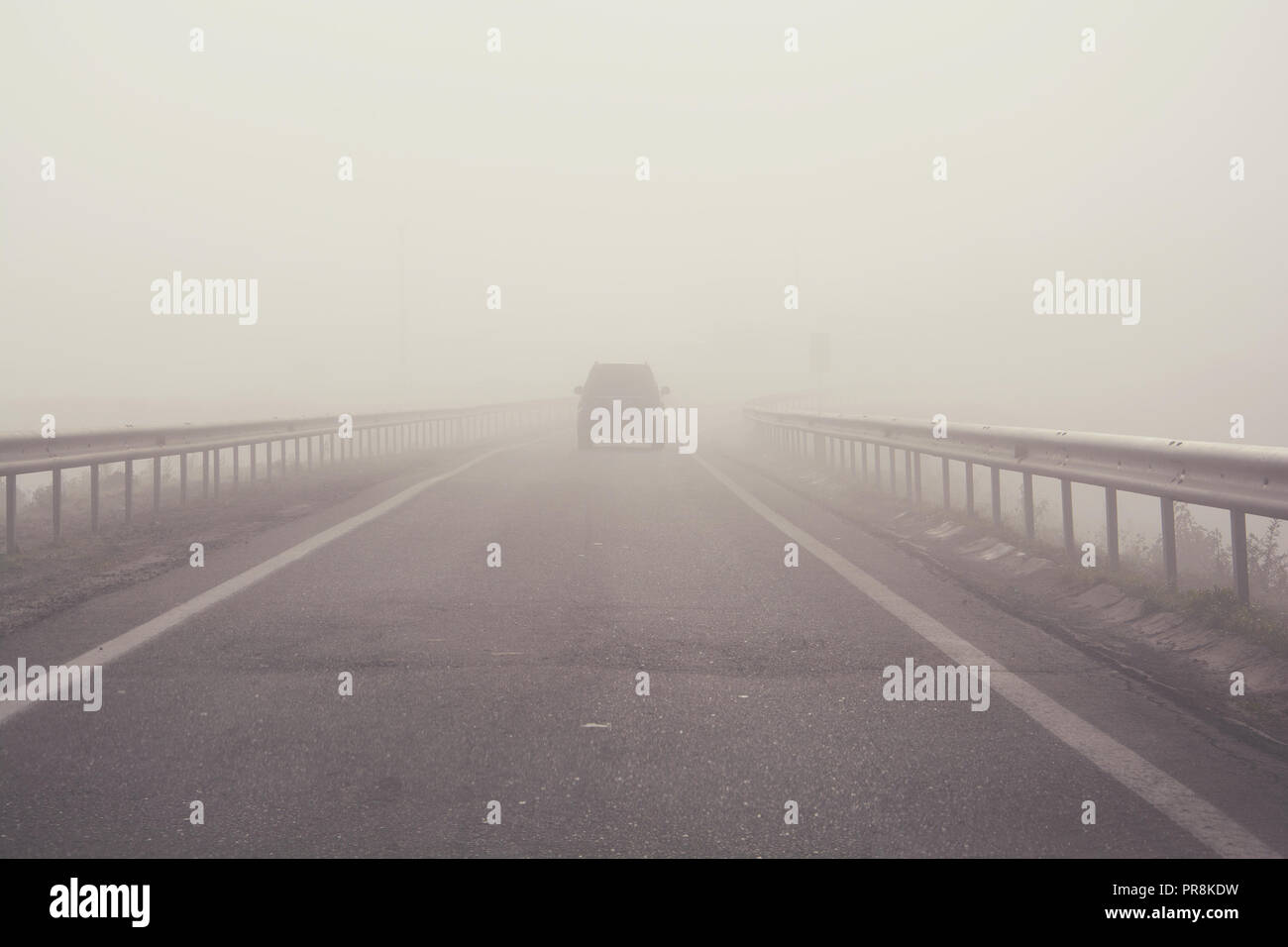 Mist on the road. Soft focus. Toned Stock Photo - Alamy