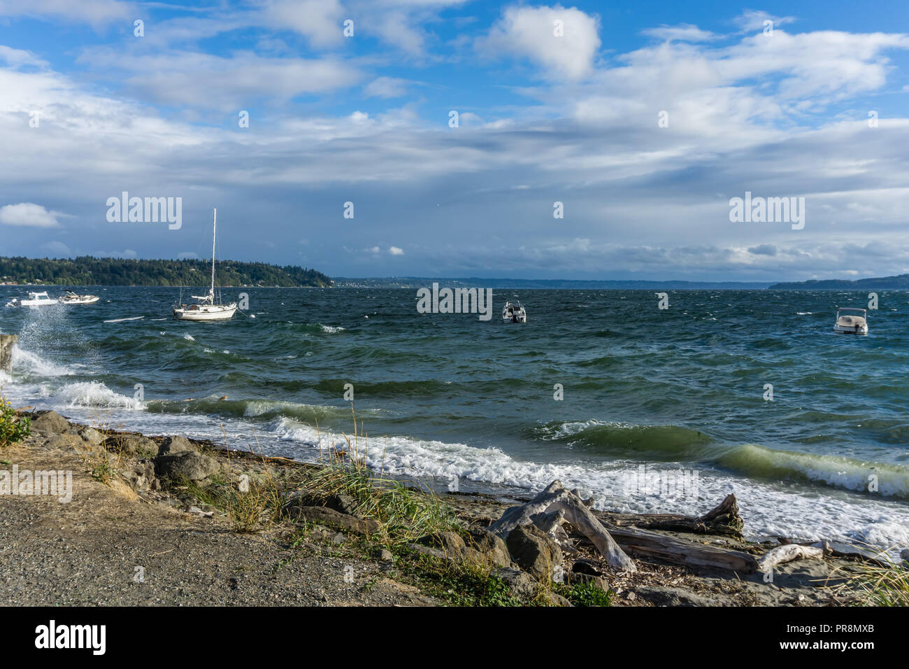 Boats are anchored at Three Tree Point in Burien, Washington on a windy ...