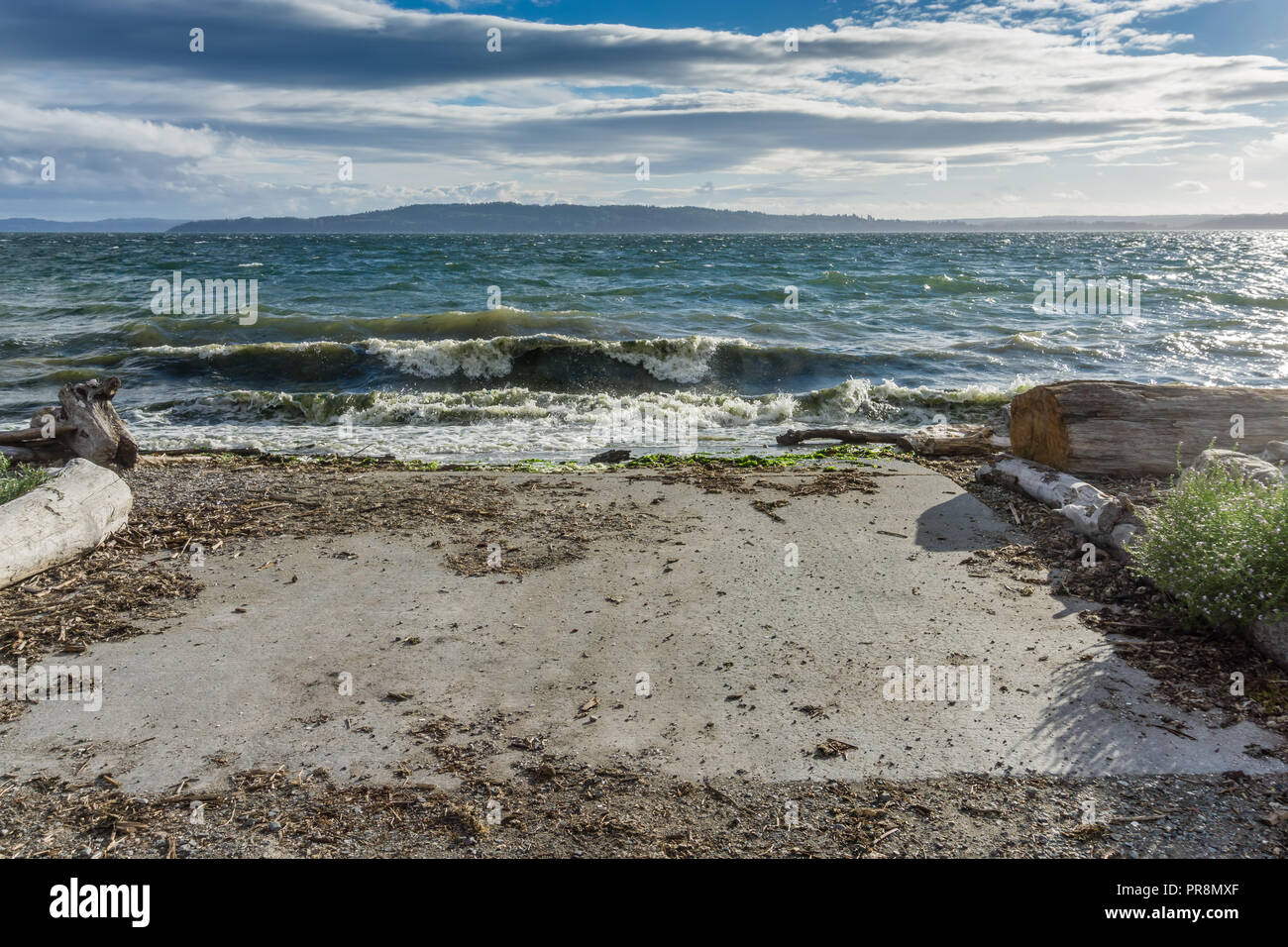 A view of the Puget Sound and a boat ramp on a windy day. The water is ...