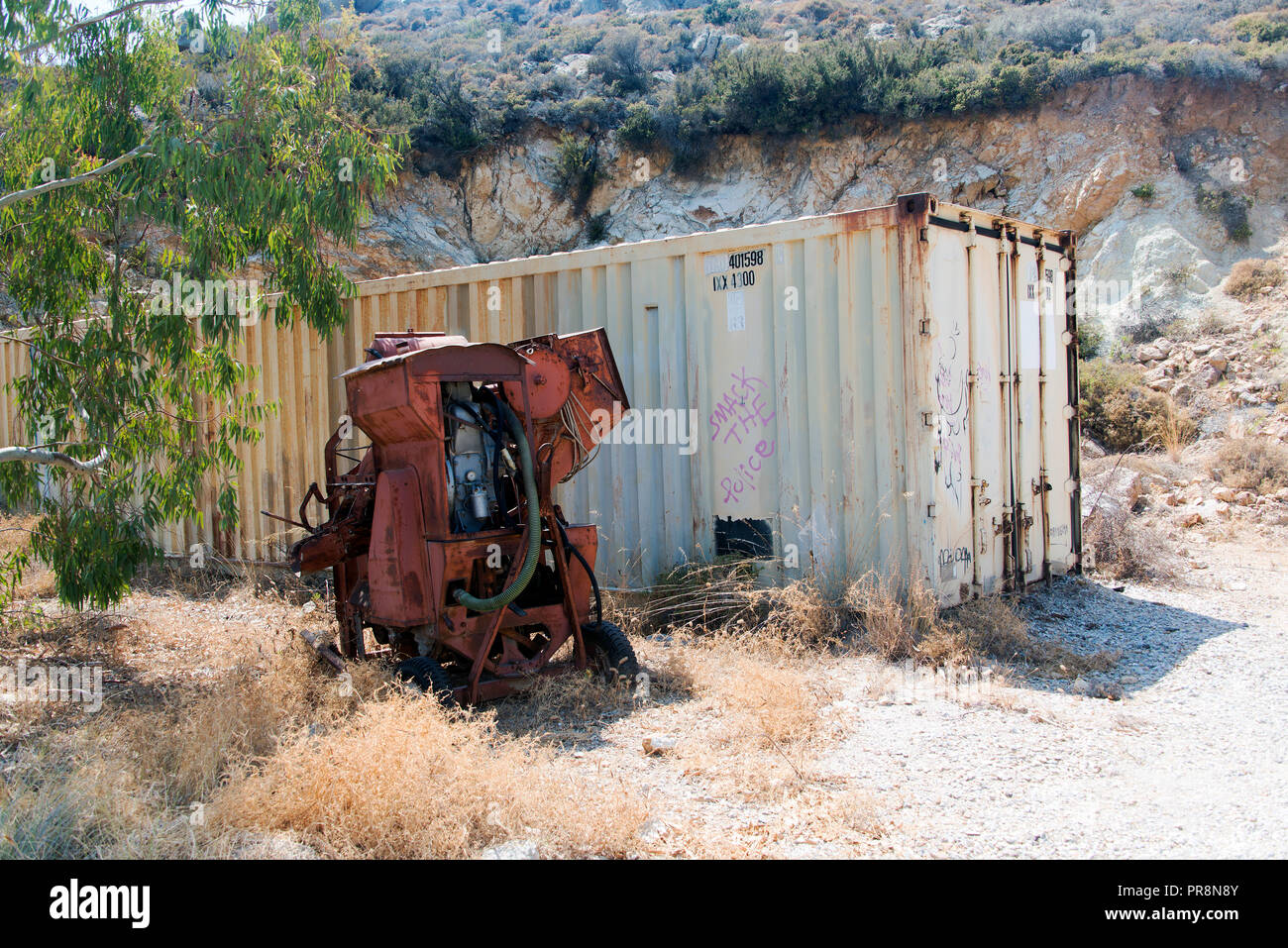 A wreck machine or equipment and a container in the street Stock Photo ...