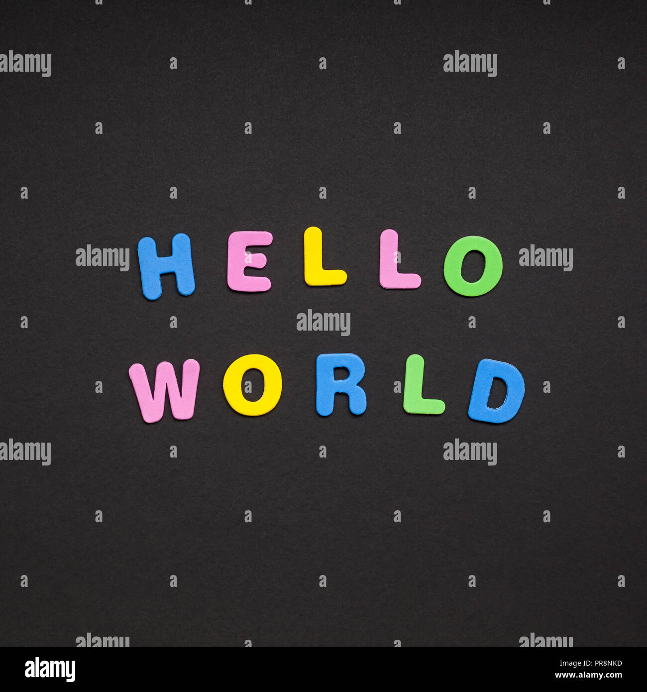 Creative colorful text made from plastic letters Hello world writing on ...
