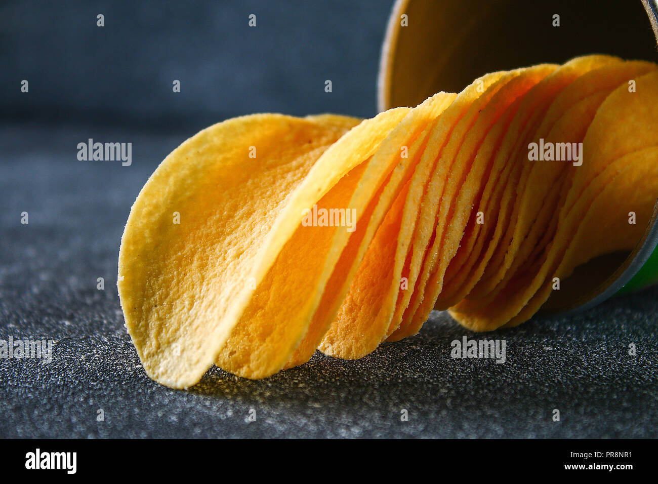 Crispy chips in a jar on a gray dark table. Snack Stock Photo - Alamy