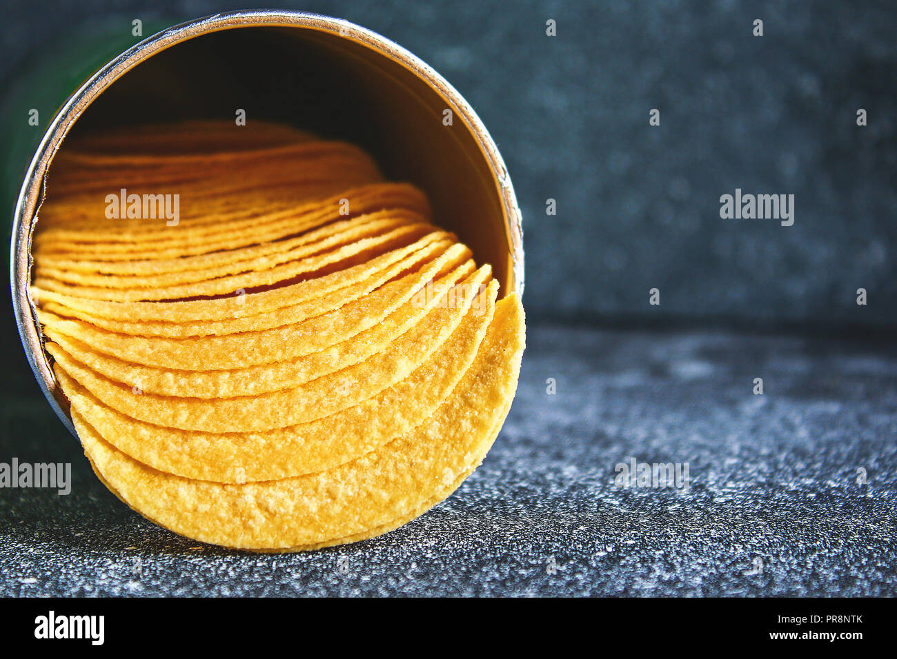 Crispy chips in a jar on a gray dark table. Snack Stock Photo - Alamy