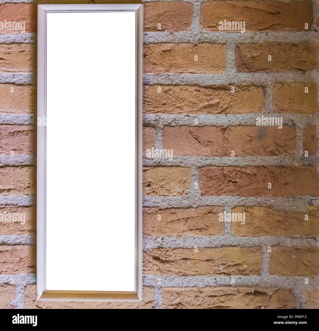 Blank small long white rectangular shaped picture frame hanging on a ...