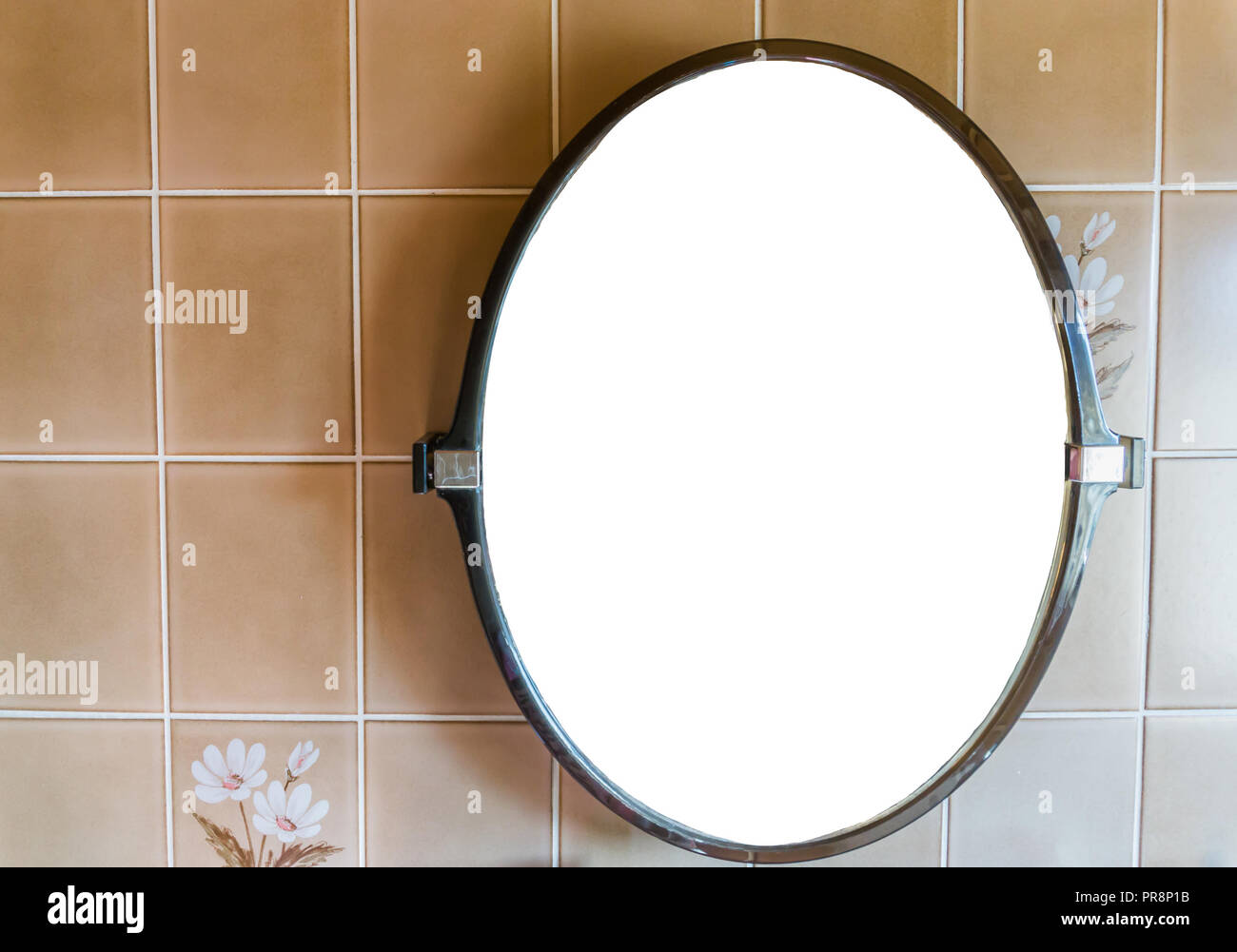 Empty blank plastic mirror hanging on the wall in the bathroom with ...