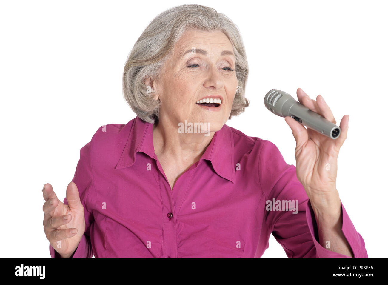 Portrait of senior singer woman on white background Stock Photo - Alamy