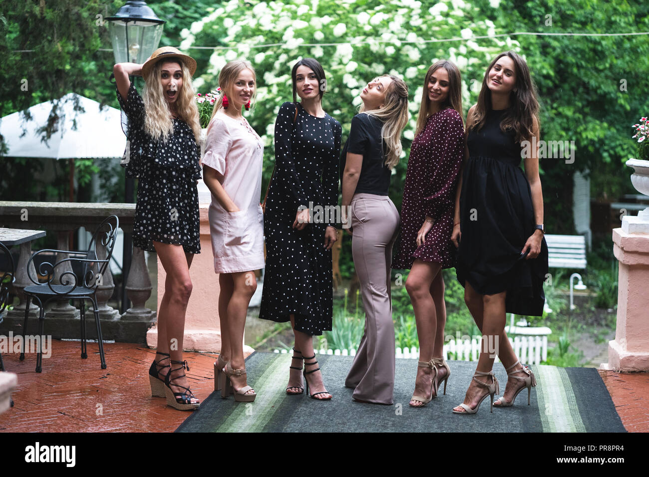 Six girls posing on camera Stock Photo - Alamy