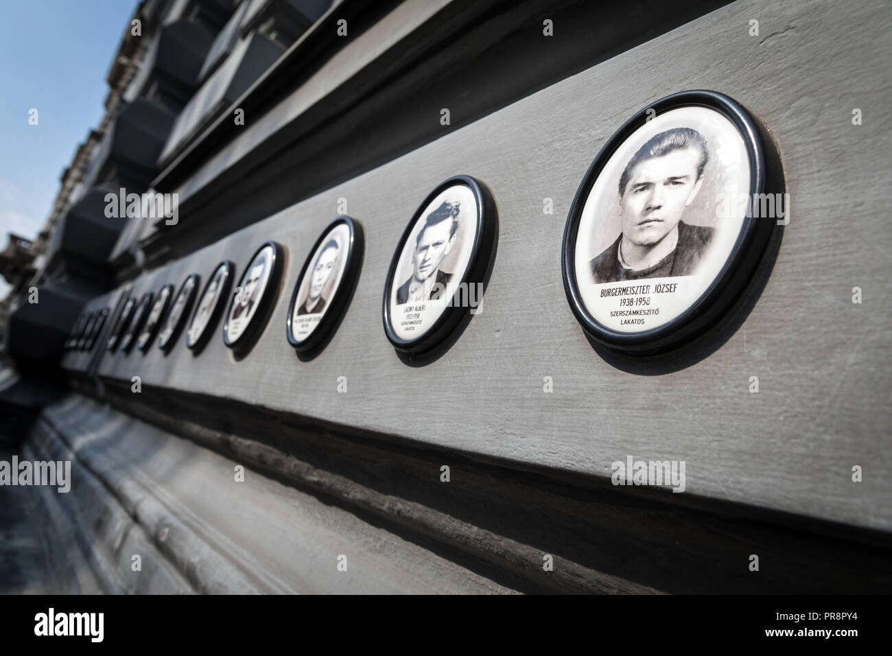 Small plaques commemorating victims on the wall of the House of Terror ...