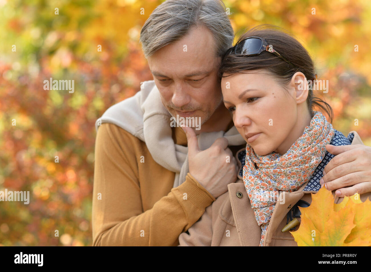 Sad couple hug park hi-res stock photography and images - Alamy
